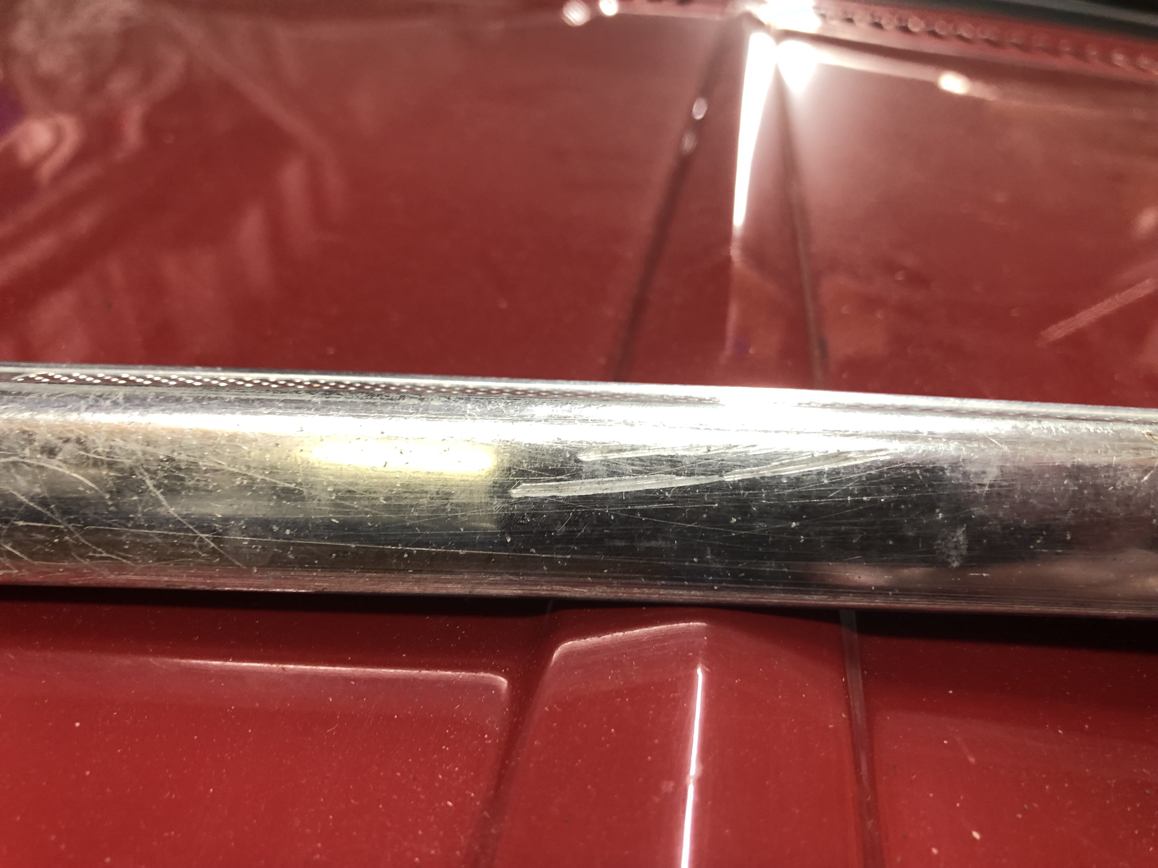 Rear panel trim between round tail lights - Body and Interior - 2002FAQ